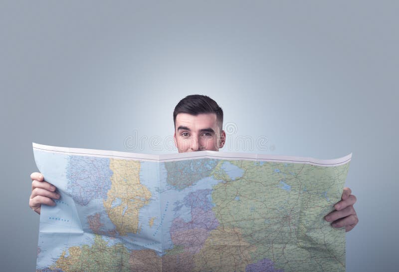Young man holding map stock image. Image of country, lifestyle - 89984523