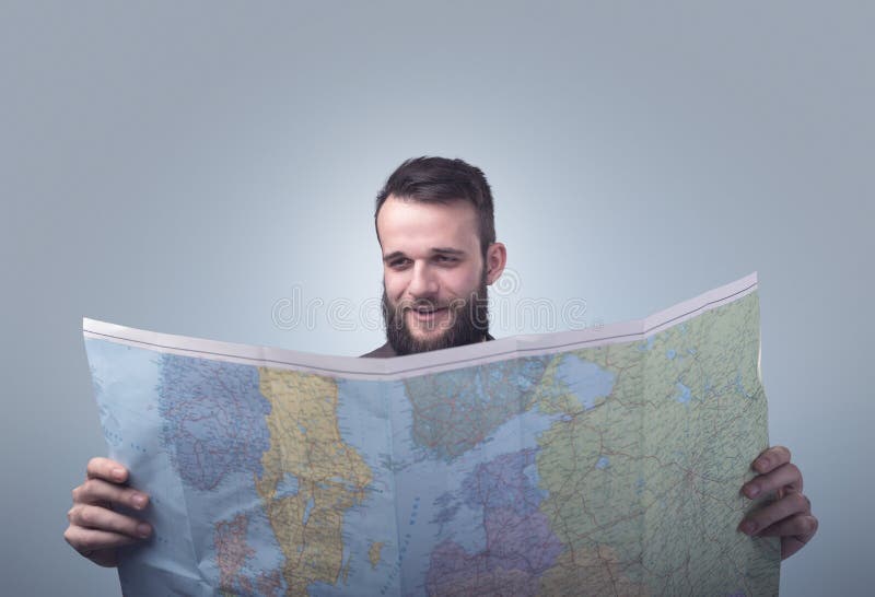 Young man holding map stock photo. Image of hobby, interest - 95991512