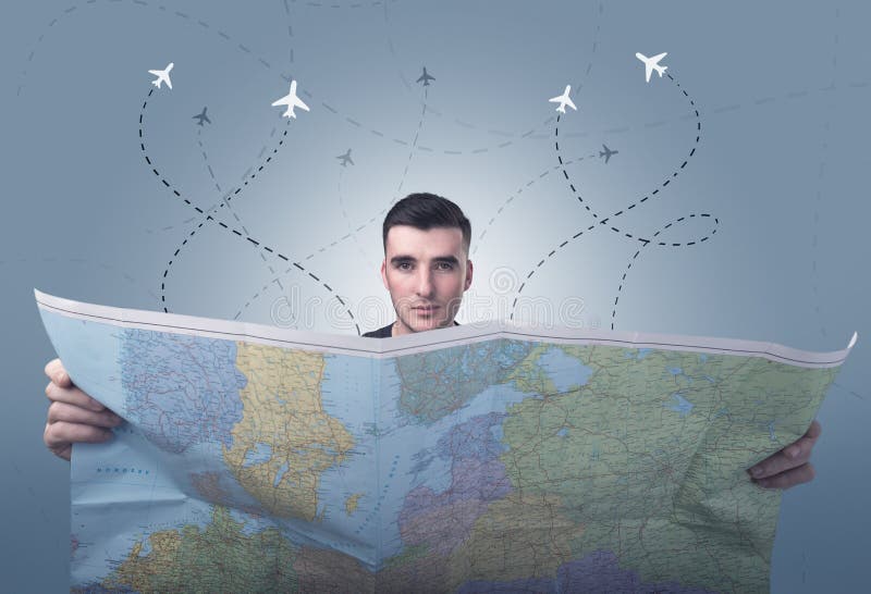 Young man holding map stock photo. Image of location - 84109124