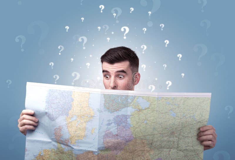 Young man holding map stock photo. Image of itinerary - 89984446