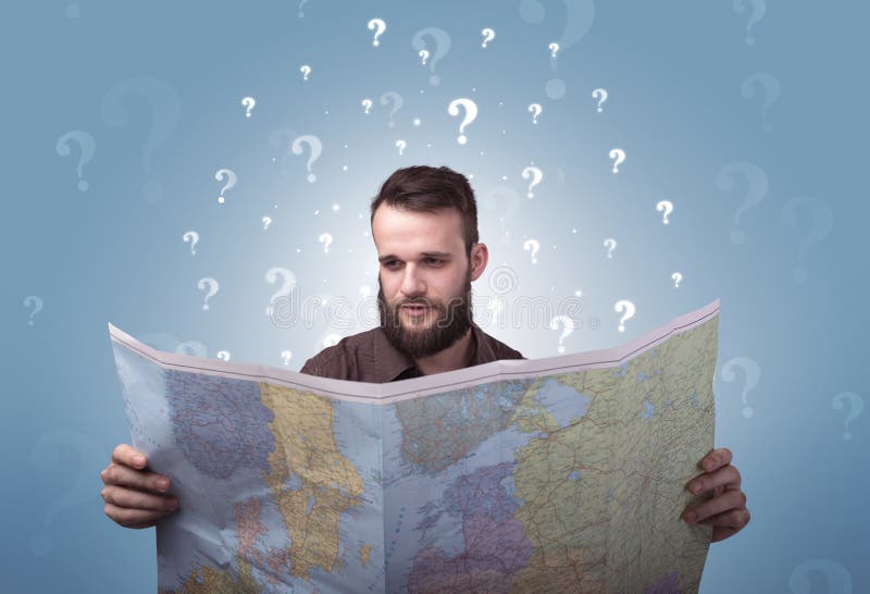 Young man holding map stock photo. Image of excursion - 94414576
