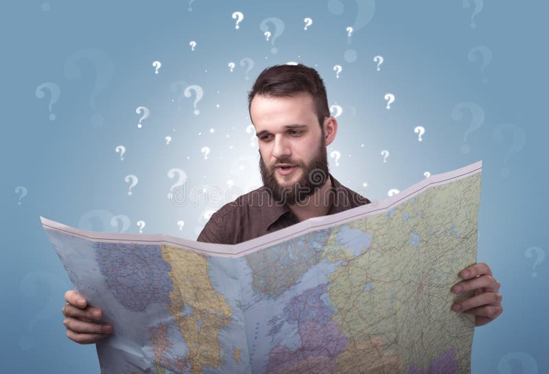 Young man holding map stock photo. Image of city, person - 96872672