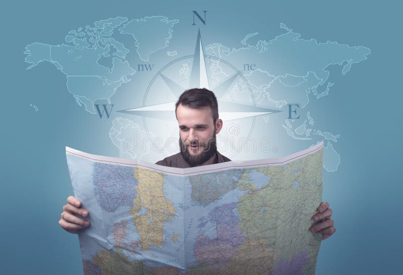 Young man holding map stock image. Image of adventure - 85830179