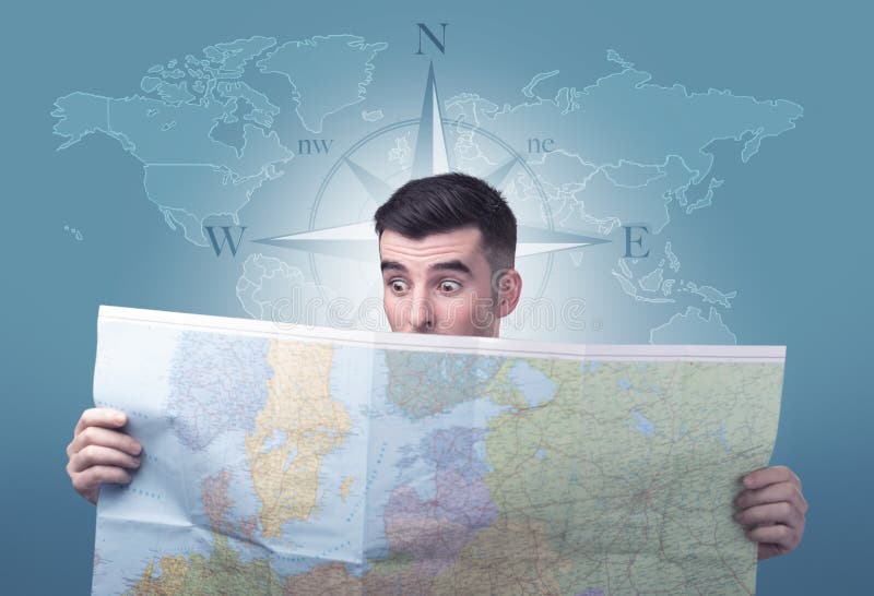 Young man holding map stock photo. Image of choice, people - 90893128