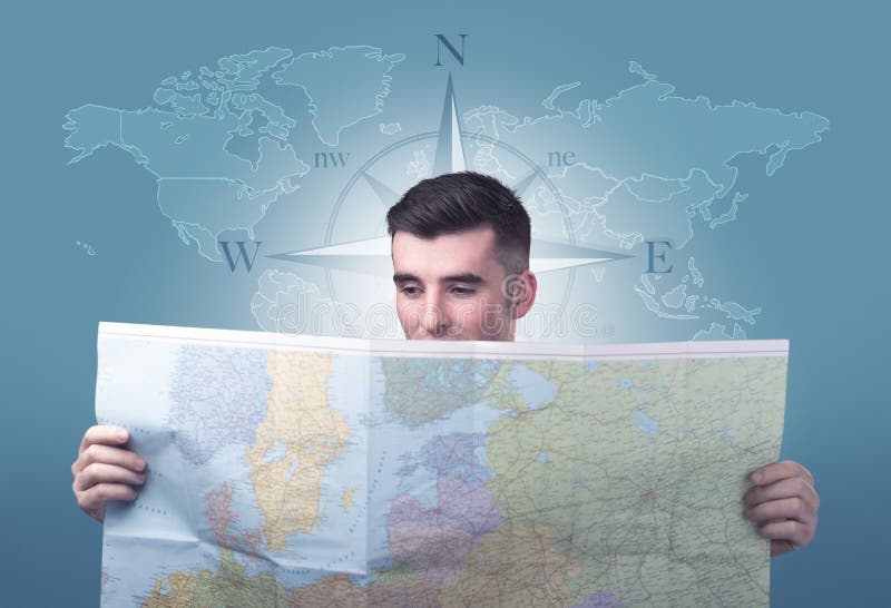 Young man holding map stock photo. Image of leisure, choice - 93627408