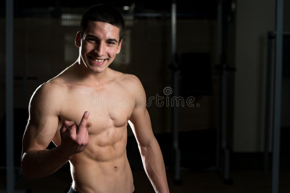 Young Man Holding Middle Finger Stock Image - Image of muscle, copy ...