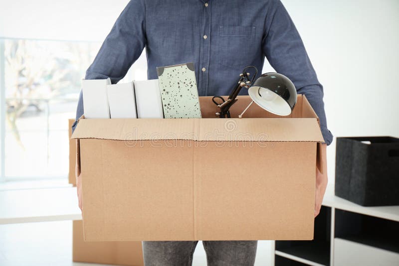 Young Man Holding Moving Box with Office Stuff Indoors Stock Image ...