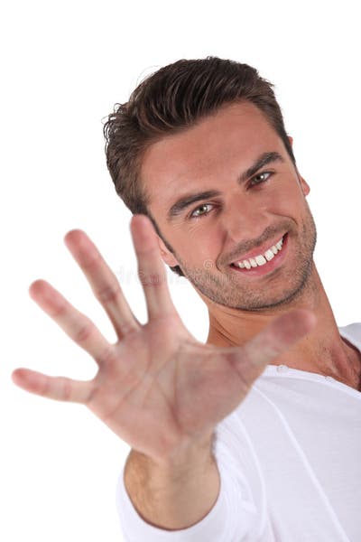 Young man holding out hand stock image. Image of human - 22727991