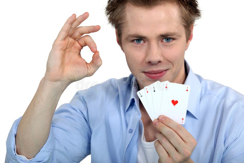 Young Man Holding Playing Cards Stock Photography - Image: 26703272