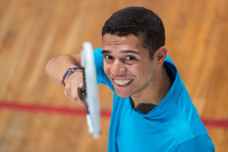 Young Man Holding Racket Holding Up Stock Image - Image of club, school ...
