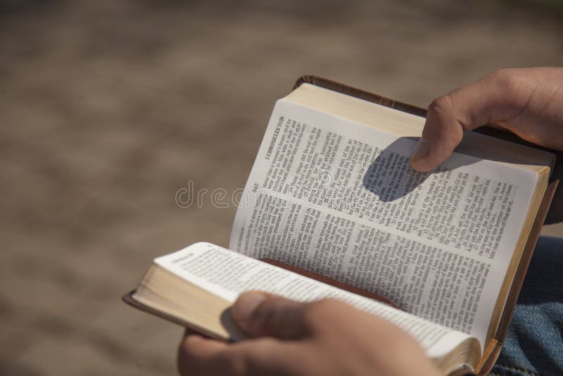 Young Man Holding and Reading Holy Bible Editorial Photo - Image of ...