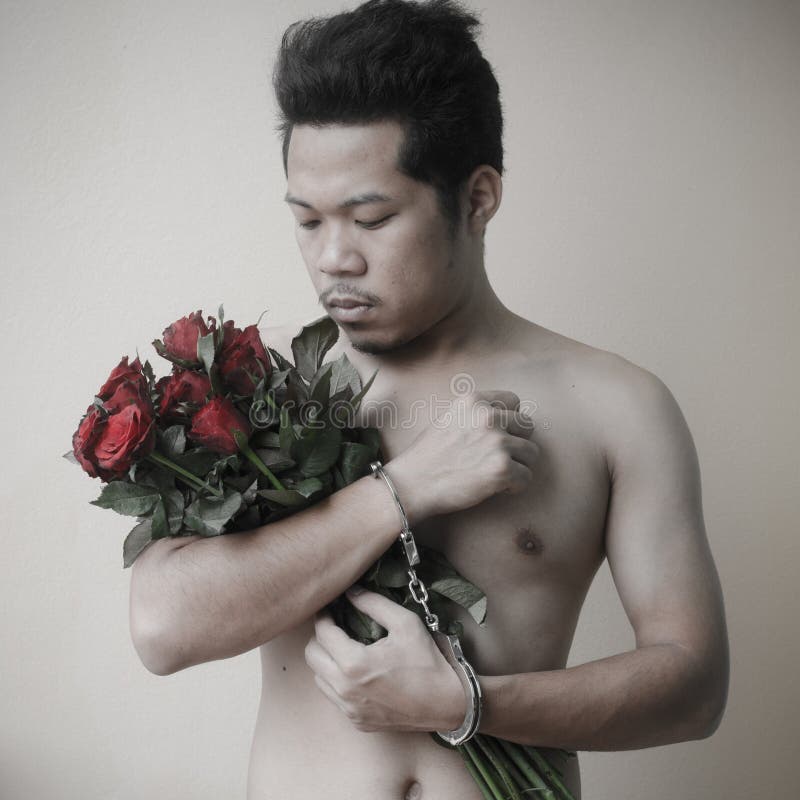 Young Man Holding Red Rose in Hand Stock Photo - Image of valentine ...