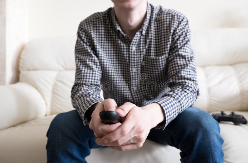 Young Man Holding Remote Controller Stock Photo - Image of remote, sofa ...