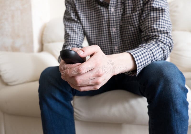 Young Man Holding Remote Controller Stock Image - Image of sitting ...
