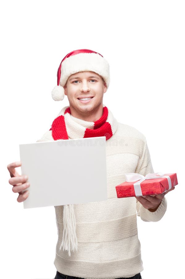Young Man Holding Small Christmas Gift and Sign Stock Photo - Image of ...