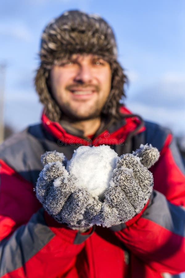 Young Man Holding a Snowball Stock Photo - Image of people, christmas ...