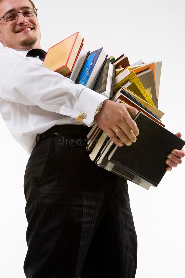 Young Man Holding Stack of Books Stock Image - Image of face, person ...