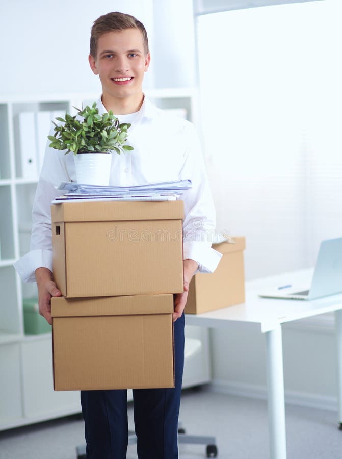 Young Man Holding a Stack of Cardboard Boxes Stock Photo - Image of ...
