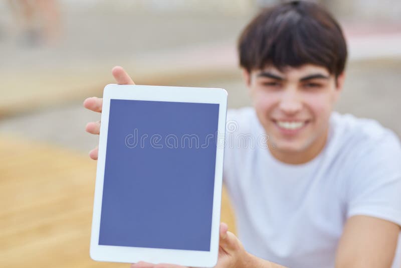 Young man holding tablet stock image. Image of ethnicity - 97224171