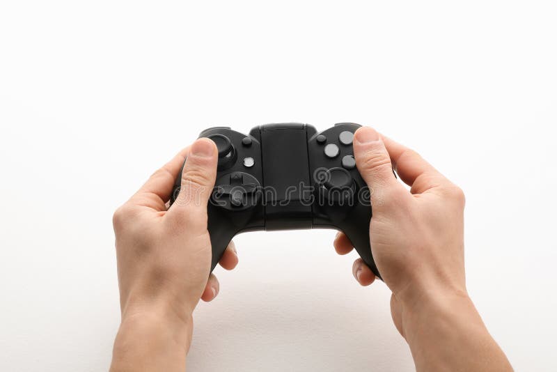Man Holding Video Game Controller On Black, Closeup Stock Photo - Image ...