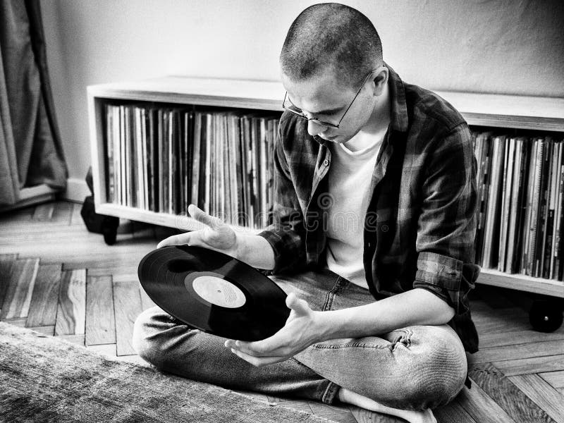 Man Holding One Vinyl Record, in the Background a Modern Turntable, the ...