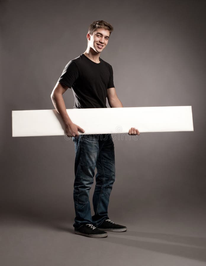 Young Man Holding a White Banner Stock Image - Image of shot, gorgeous ...