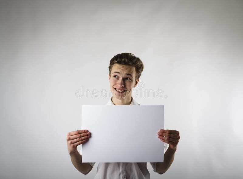 Young Man Holding White Paper in His Hands. Stock Image - Image of ...