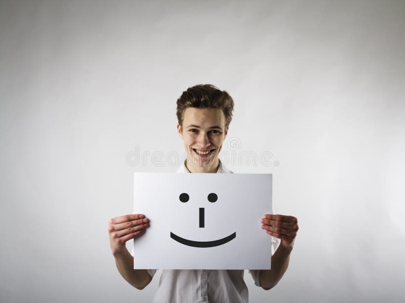 Young Man is Holding White Paper with Smile. Happy Man Stock ...