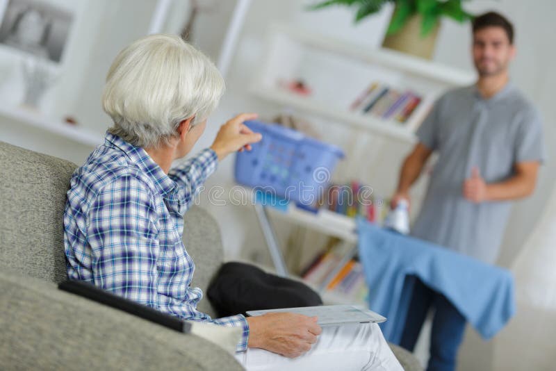 Young Man Home Help Older Woman Stock Photo - Image of patient, care ...