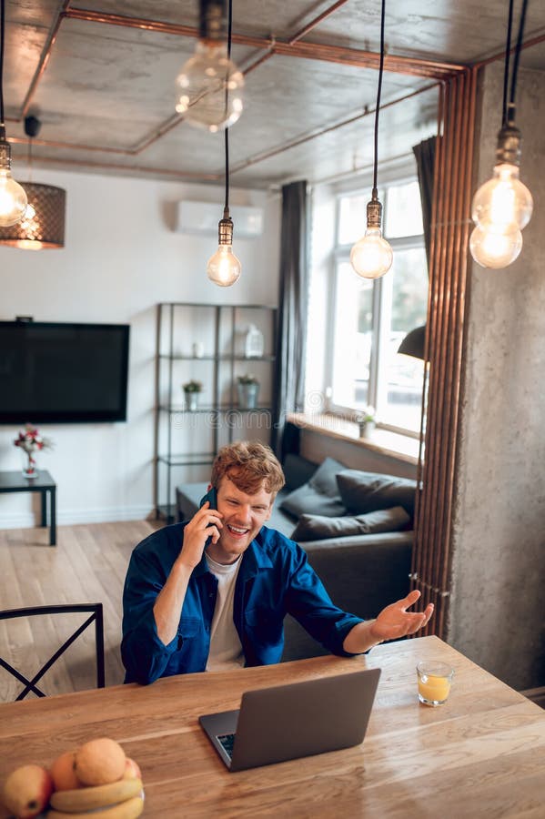 Young Man in the Home Office Having a Phone Call Stock Photo - Image of ...