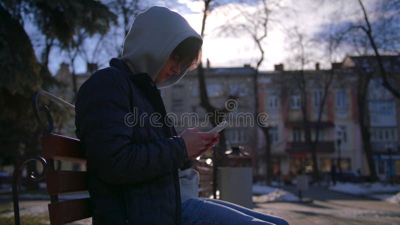 Texting His Way Around. a Handsome Young Man Using His Cellphone on ...