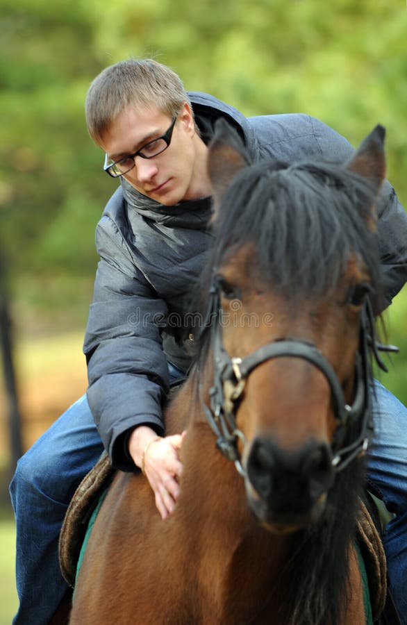 Young man on a horse stock photo. Image of rider, brown - 39042698