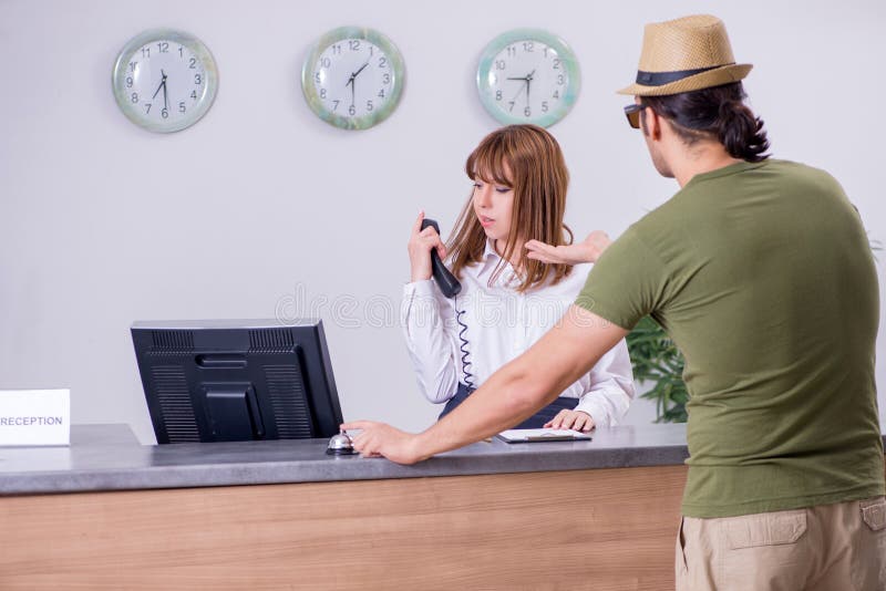 Young Man at the Hotel Reception Stock Photo - Image of check ...