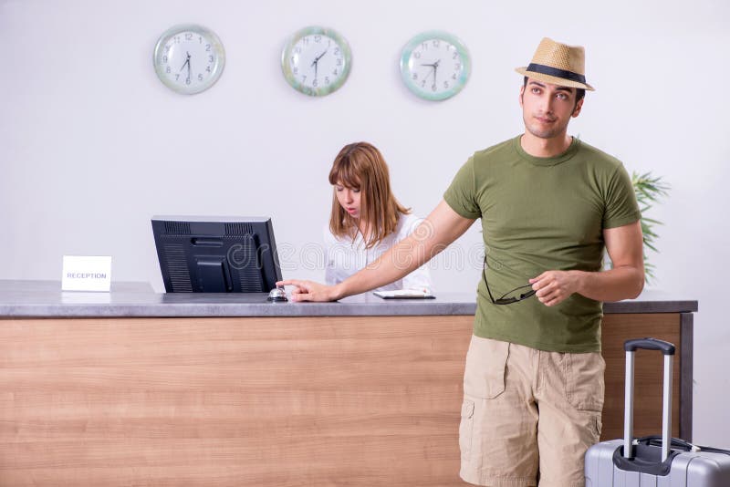 Young Man at the Hotel Reception Stock Photo - Image of lounge, button ...