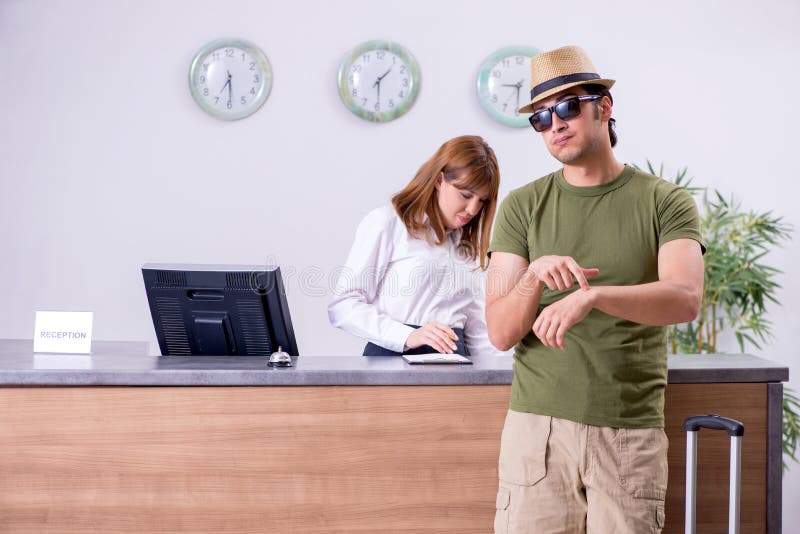 Young Man at the Hotel Reception Stock Photo - Image of office ...