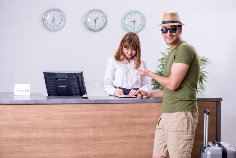 Young Man at the Hotel Reception Stock Photo - Image of hostel, client ...
