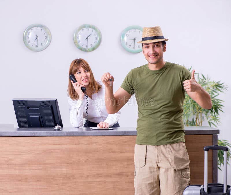 Young Man at the Hotel Reception Stock Image - Image of counter ...