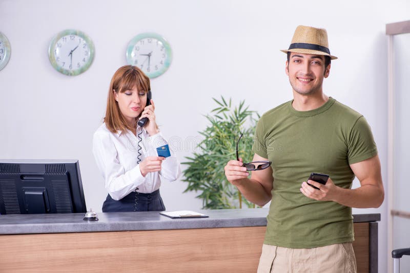 Young Man at the Hotel Reception Stock Image - Image of checkout, check ...