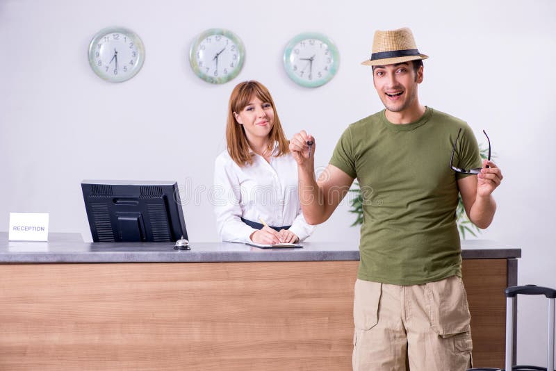 Young Man at the Hotel Reception Stock Image - Image of assistance ...