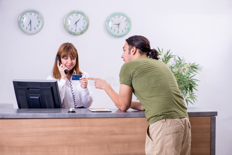 Young Man at the Hotel Reception Stock Image - Image of checkout ...