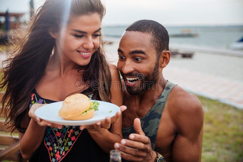 Young Man Hungry Looking at the Burger on a Plate Stock Photo - Image ...