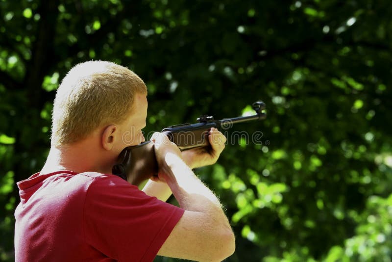 Young Man with a Hunting Rifle Stock Photo - Image of bush, bullet: 4896068