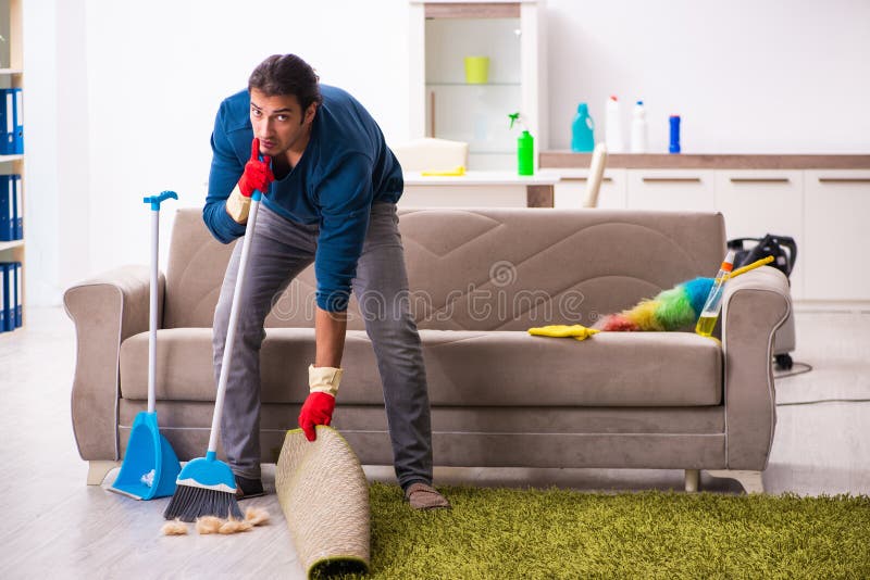 Husband Doing Housework while Wife Resting Stock Photo - Image of ...