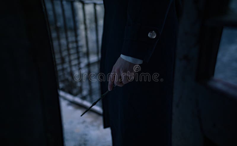 Young Man in Image of Black Magician with Magic Wand in His Hand Stock ...