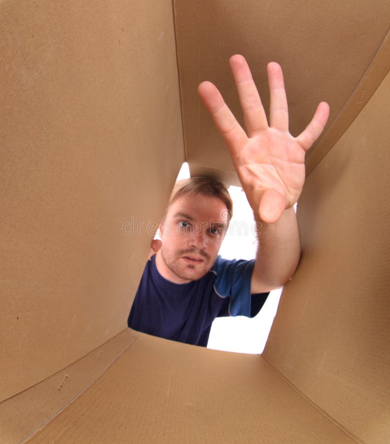 Young man inside box stock image. Image of package, face - 11085529