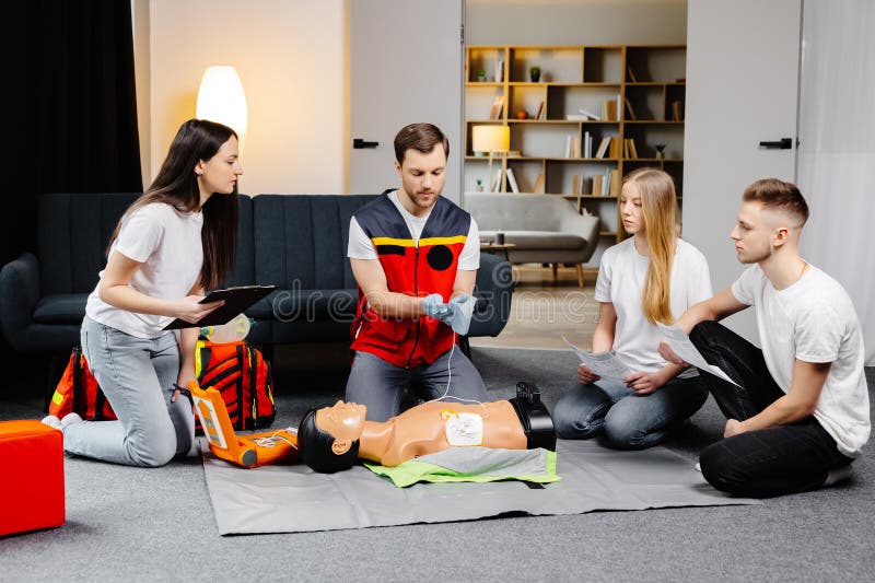 Group of People with Cpr Dummy Looking at Camera and Smiling after ...