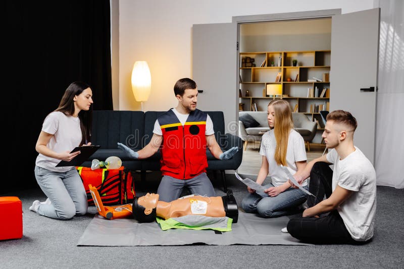 Group of People with Cpr Dummy Looking at Camera and Smiling after ...