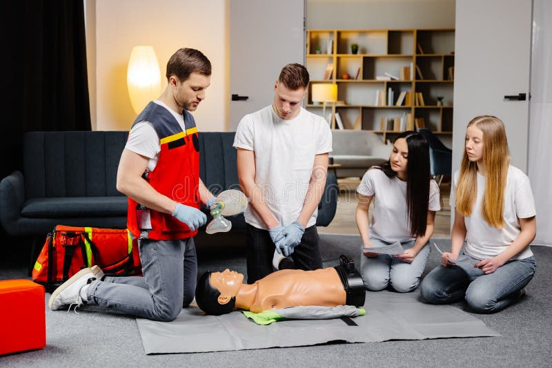Group of People with Cpr Dummy Looking at Camera and Smiling after ...
