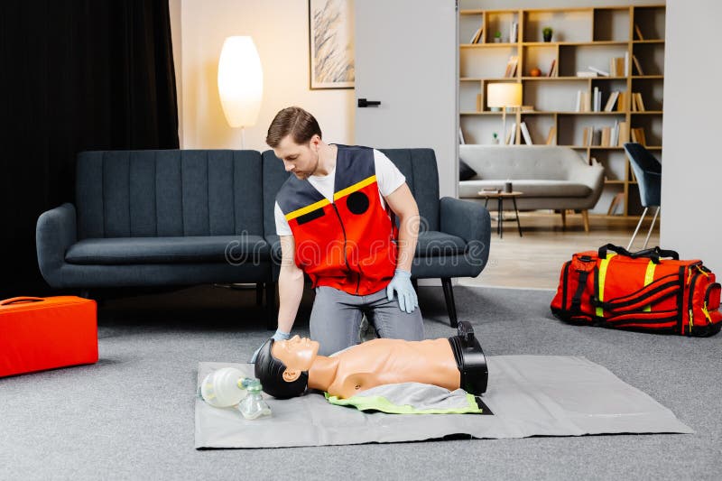 Young Man Instructor Preparing To Make First Aid Heart Compressions ...