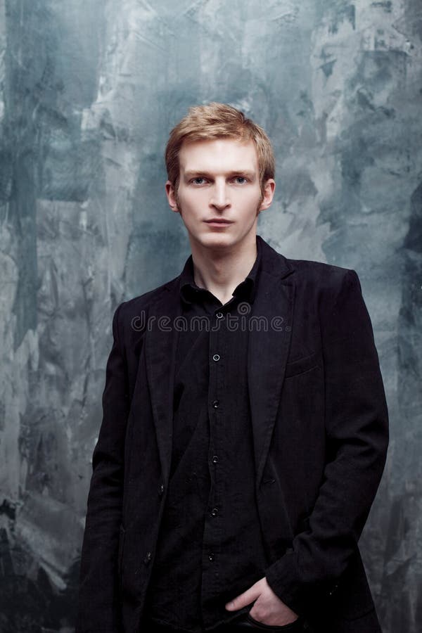 Young Man in Jacket Thoughtfully Looks into the Camera Stock Image ...